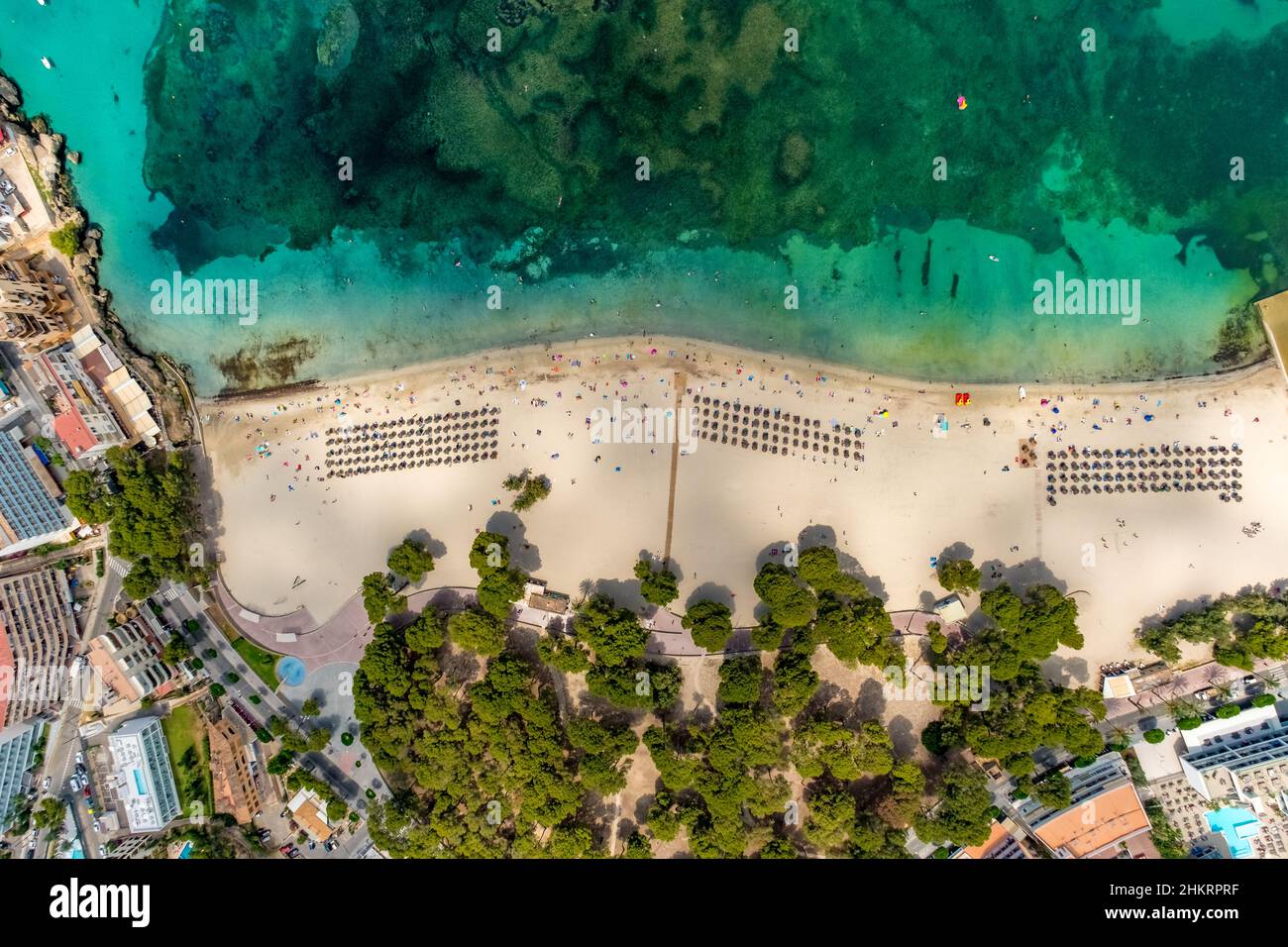 Aerial view, sunbathing and bathing at the sandy beach Platja de Santa ...
