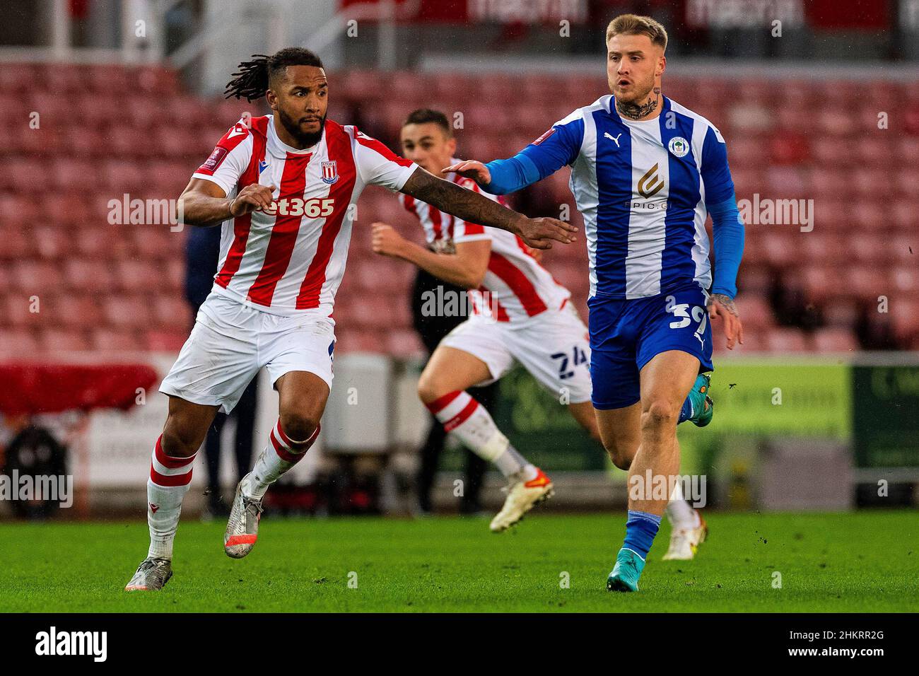 Liam Moor #6 of Stoke City and Stephen Humphrys #39 of Wigan Athletic ...