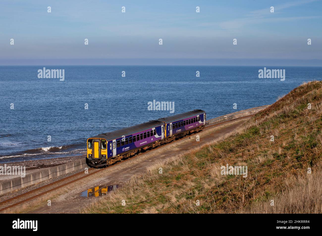 2 Northern rail class 153 sprinter trains running alongside the sea on ...