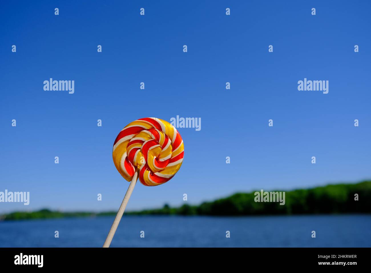 Colorful rainbow lollipop and nature background. High quality photo ...
