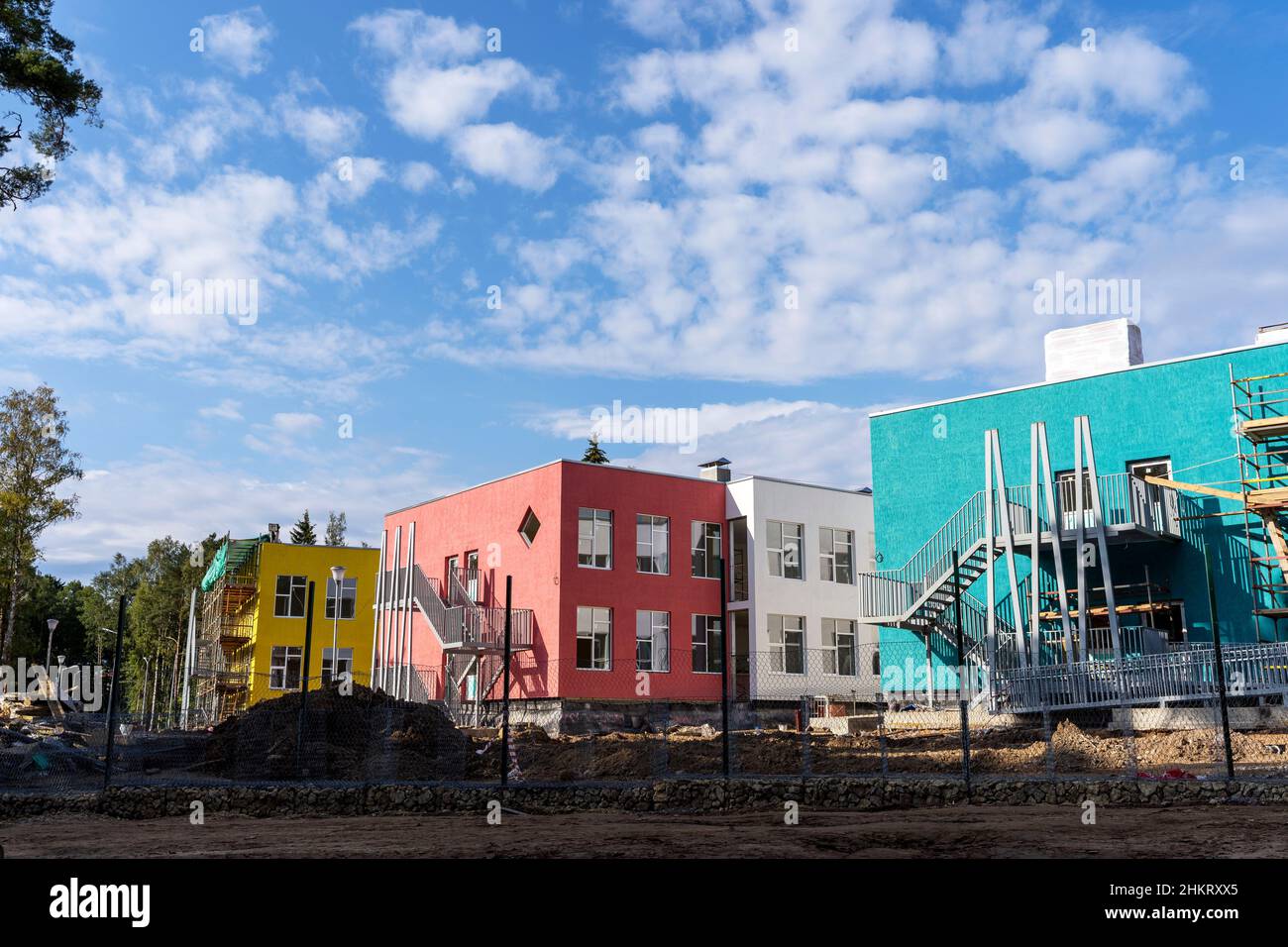 The progress of the construction of the kindergarten building. Colorful ...