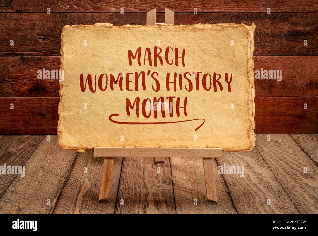 March Women History Month, handwriting on a rough handmade paper, easel ...