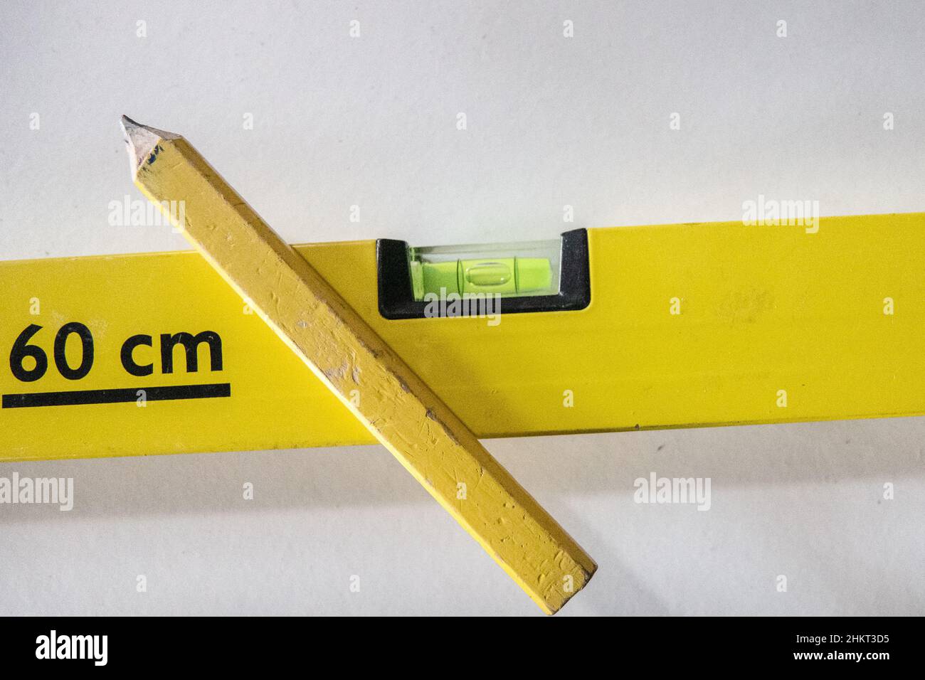 spirit level and yellow pencil Stock Photo - Alamy