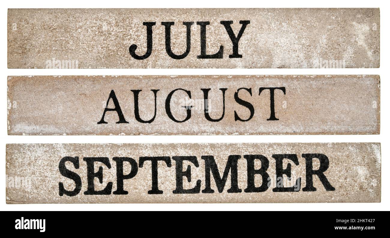 July, August and September months - rough text on grunge wooden blocks ...