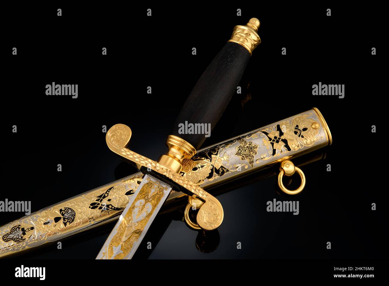 souvenir collectible silver gold dagger with scabbard on black. Luxury ...