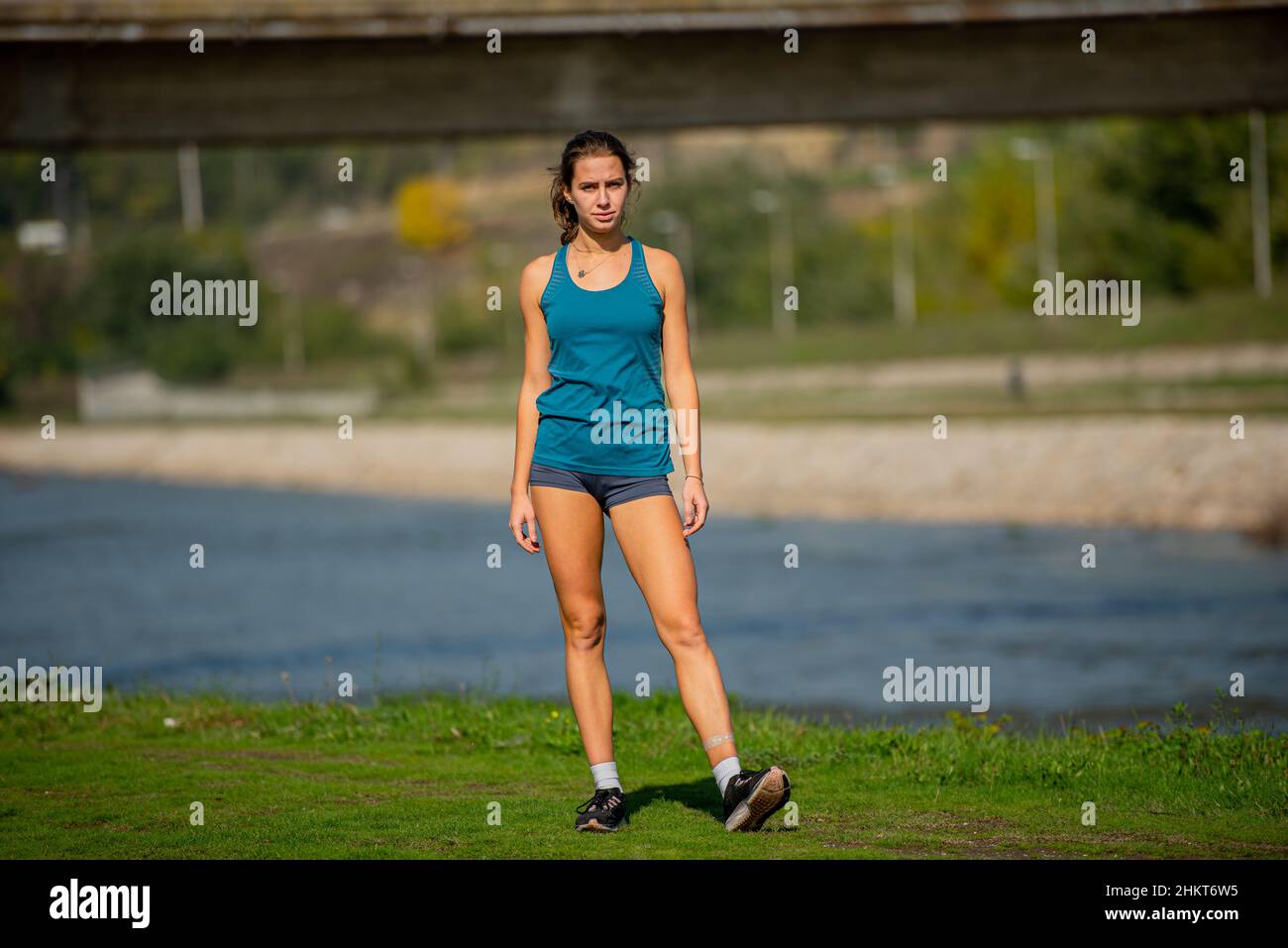 Attractive and beautiful girl is standing and taking a break form ...