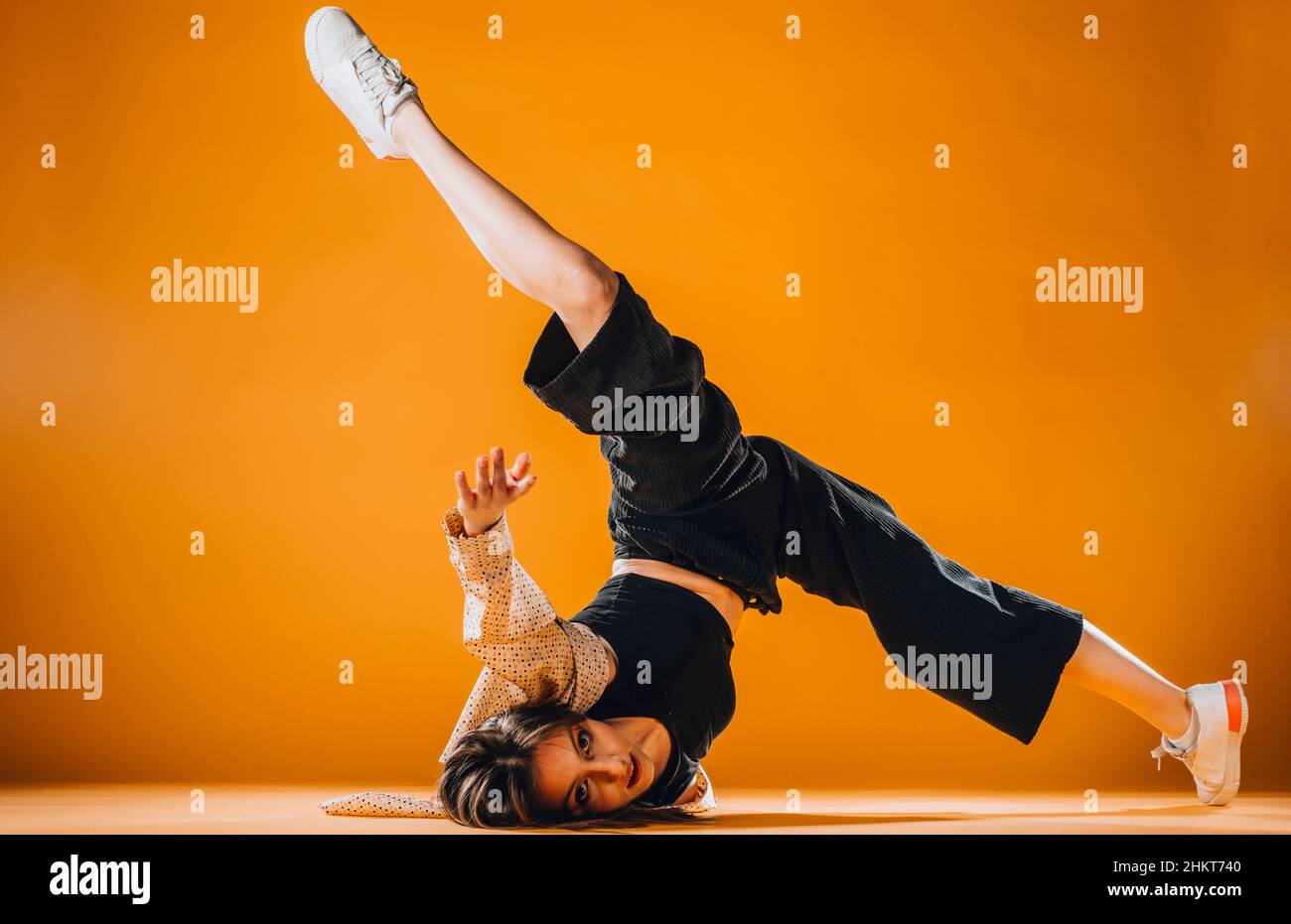 Athletic dancer performing an element of dance gymnastics Stock Photo ...