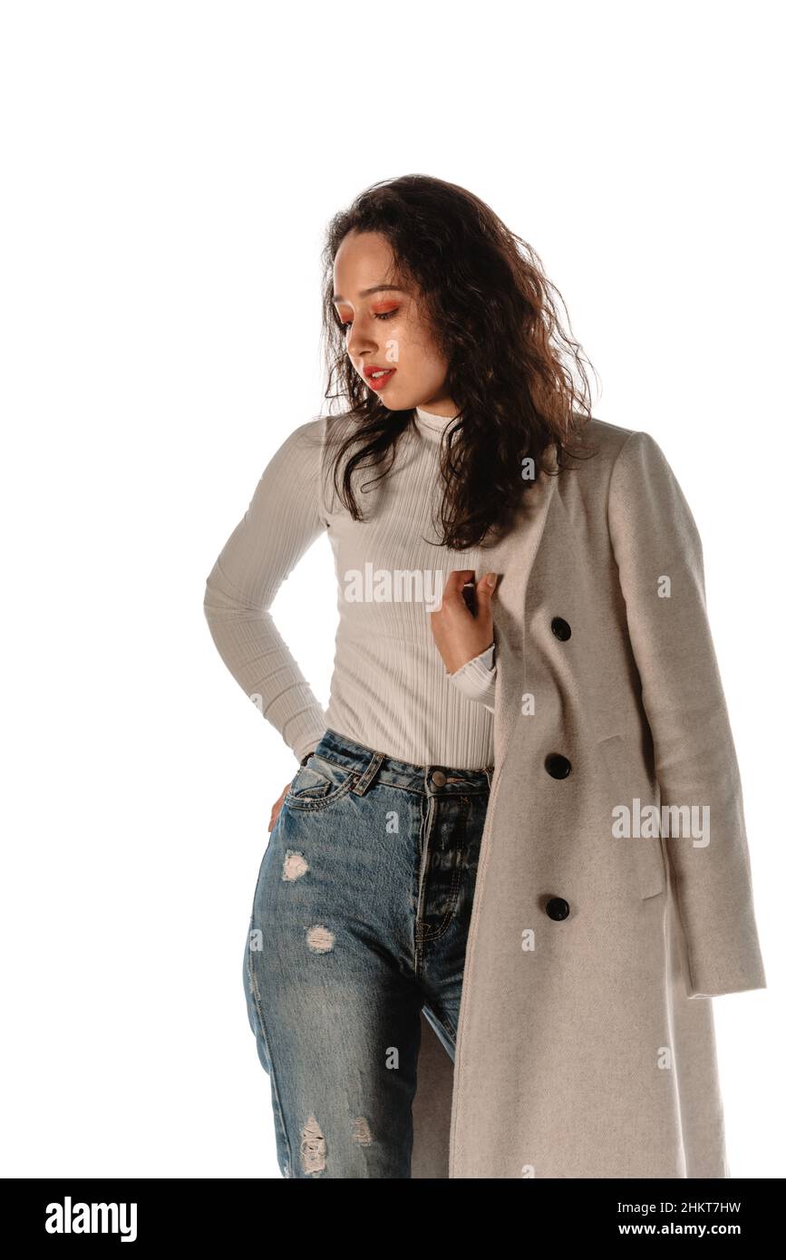 Portrait of a beautiful stylish girl posing in trendy modern clothes ...