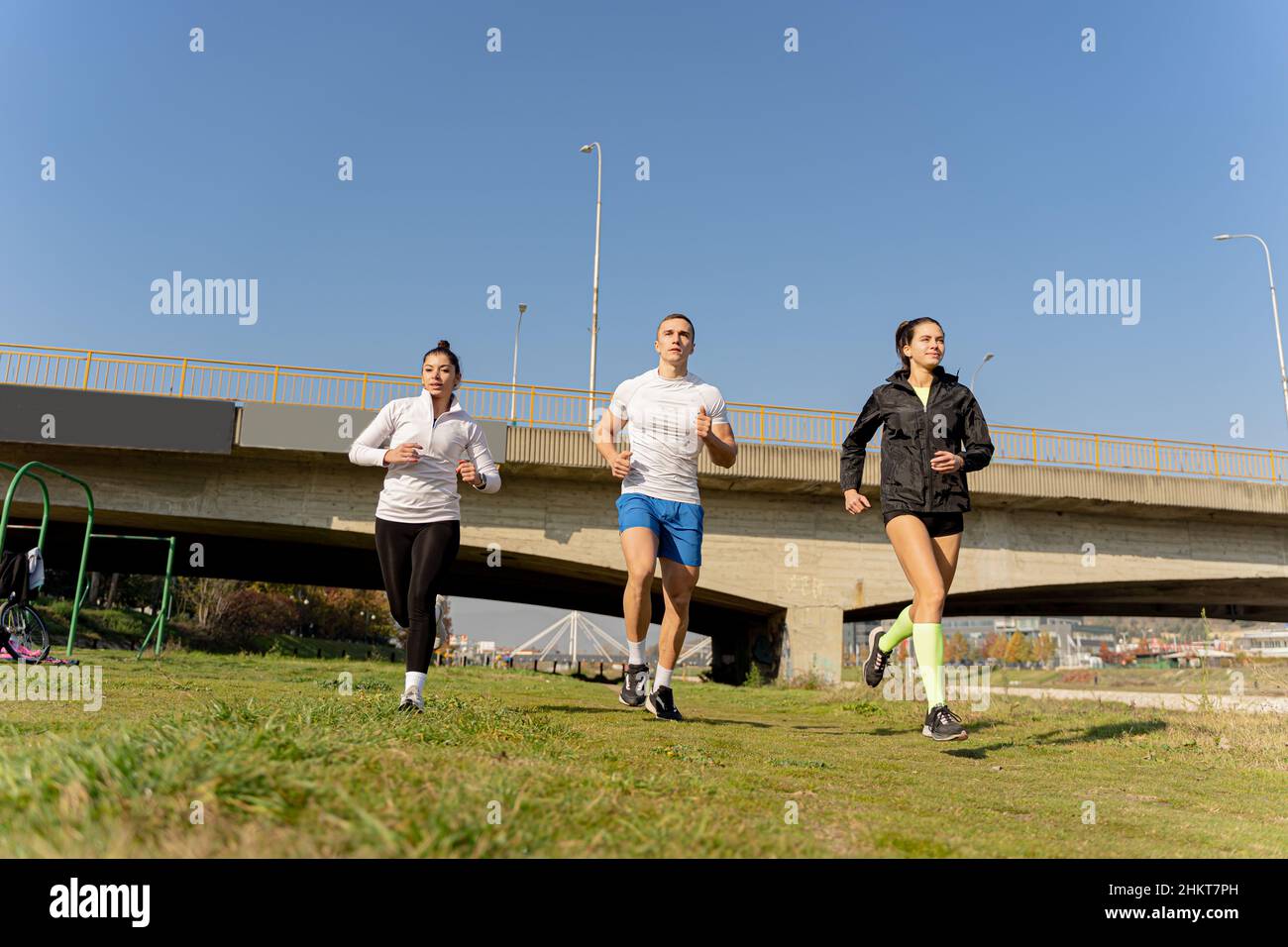 Three attractive and amazing friends are enjoyig and running together ...