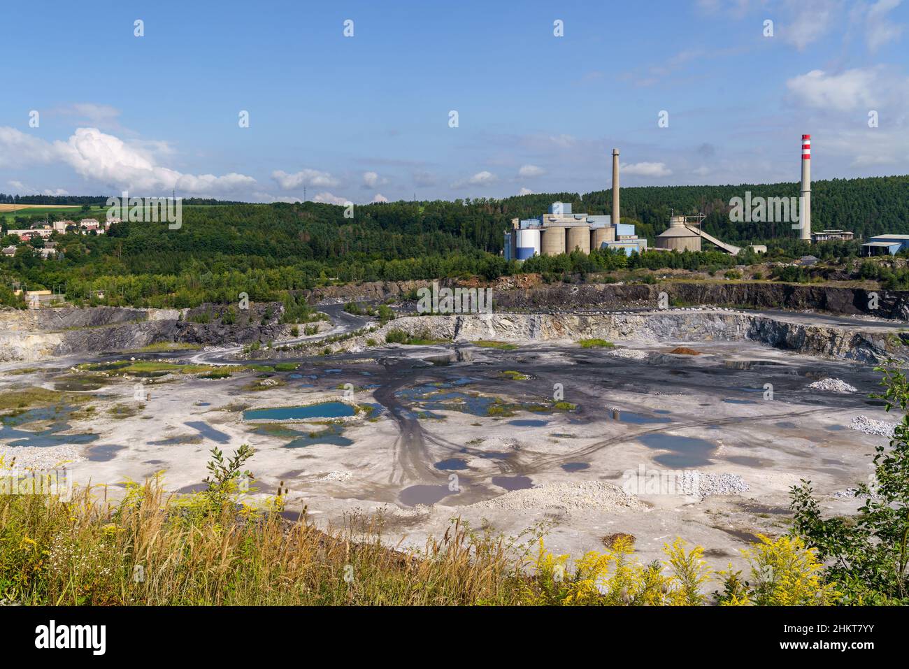 Opencast mining quarry with machinery and mining equipment. Limestone ...