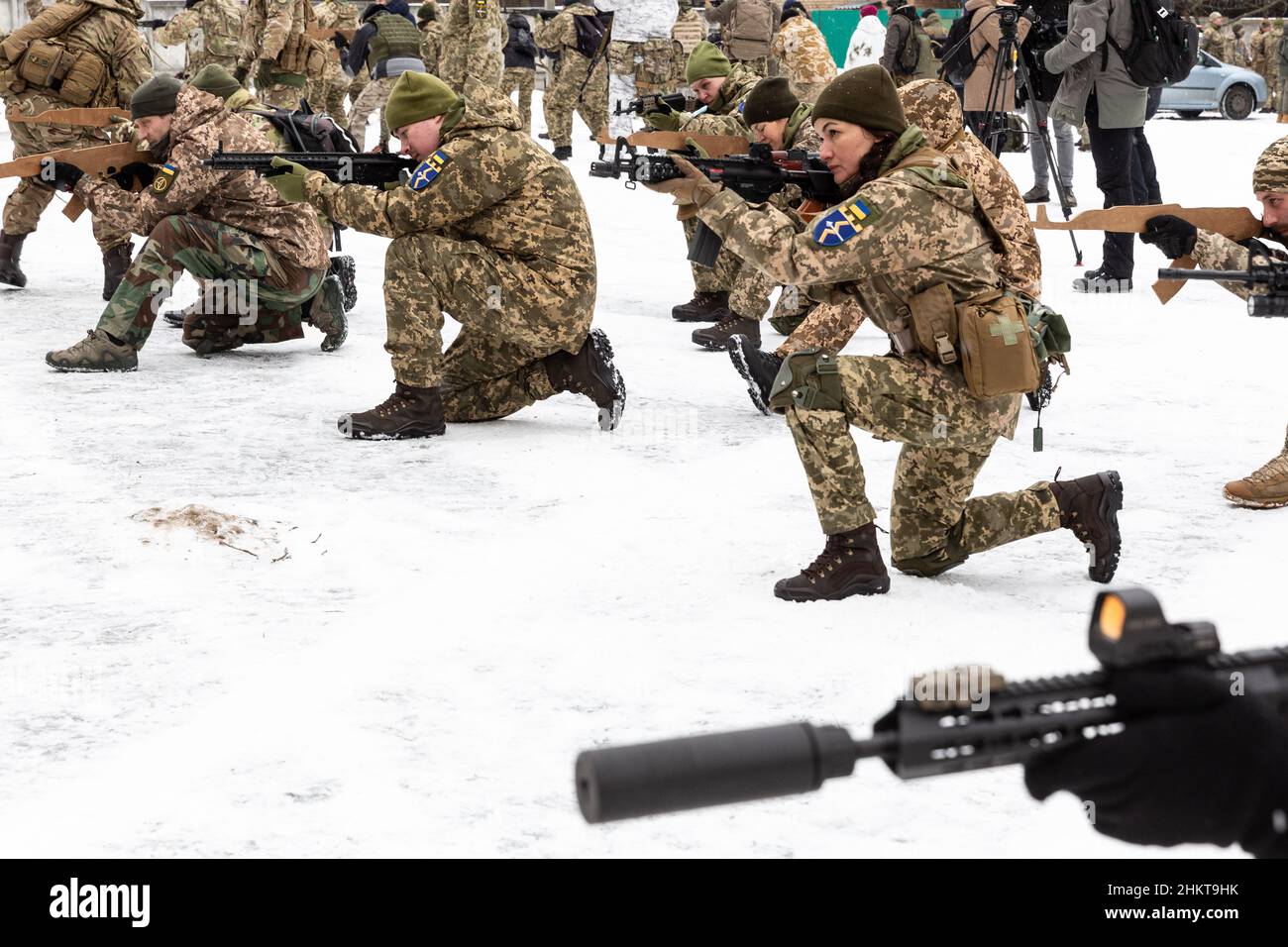 Civilians hold rifles during Territorial Defence Force exercise while ...