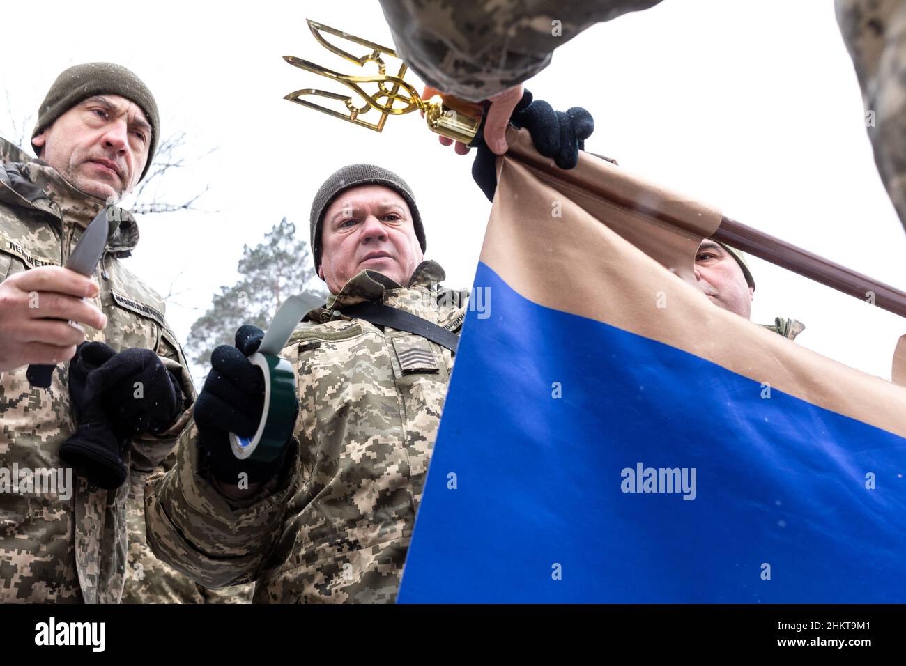 Reservists fold their flag during a Territorial Defence Force exercise ...