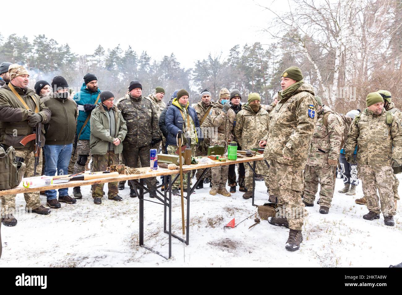 Civilians being shown tactical equipment during a Territorial Defence ...