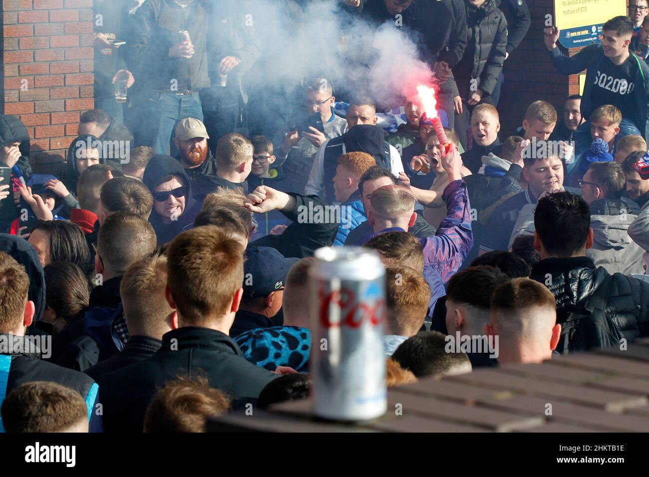 Hartlepool United fans with a red flare Stock Photo - Alamy