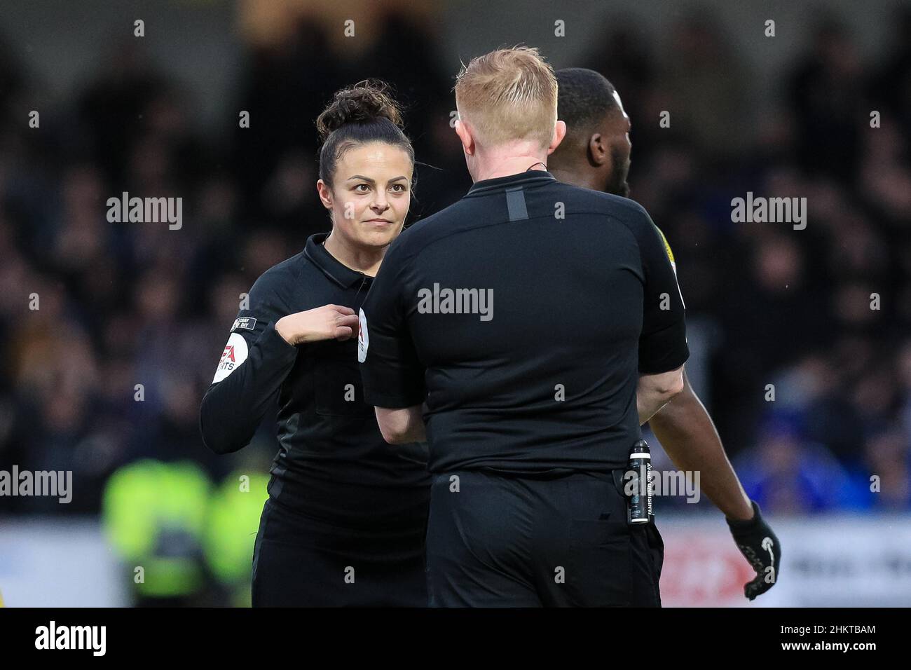 Lineswoman Lisa Rashid speaks with Referee Alan Young during the game ...