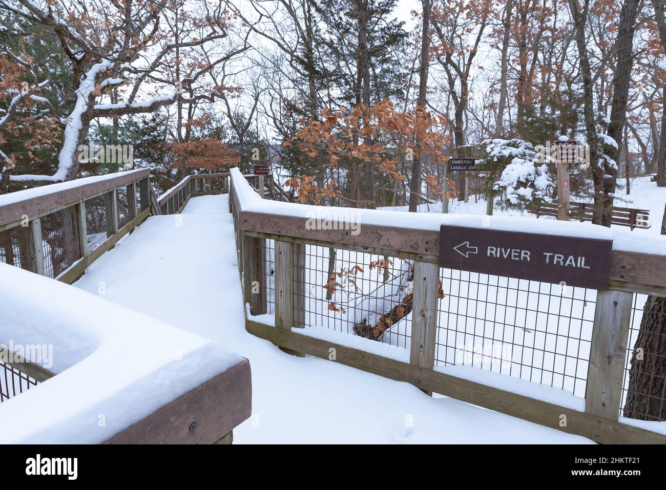 Wooden pathway along the snow covered landscape. Starved Rock State ...