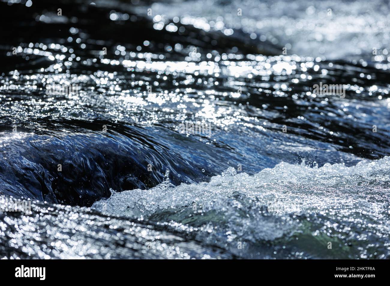 Flowing blue fresh water in river Stock Photo - Alamy