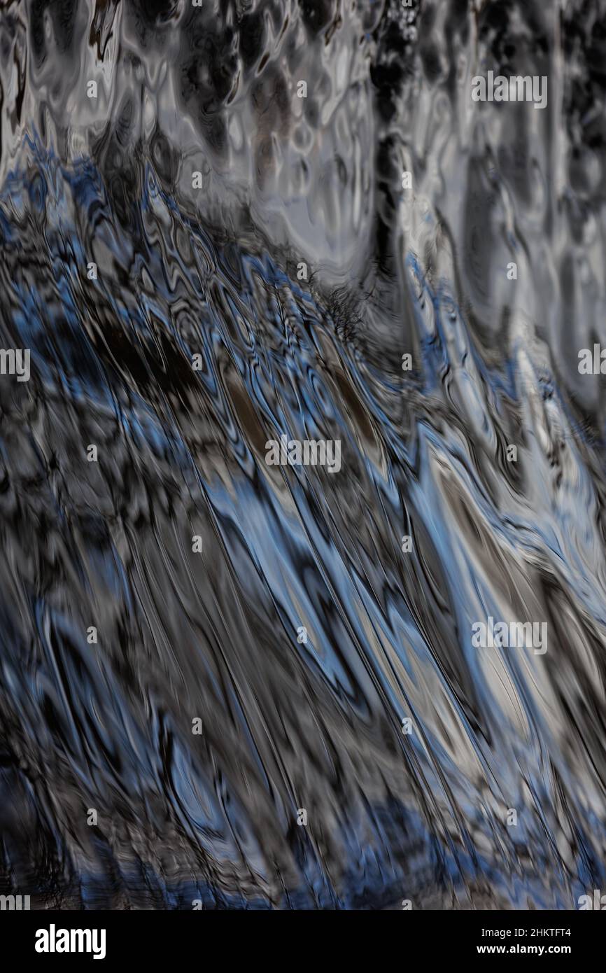 Flowing silver water texture of a river Stock Photo - Alamy