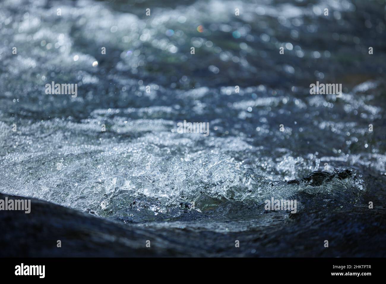 Flowing blue fresh water in river Stock Photo - Alamy