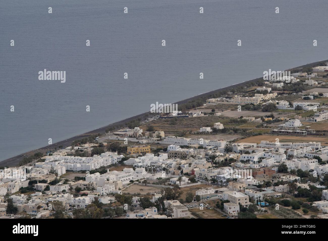 Panoramic view of the village of Perissa and the sea from a viewpoint ...
