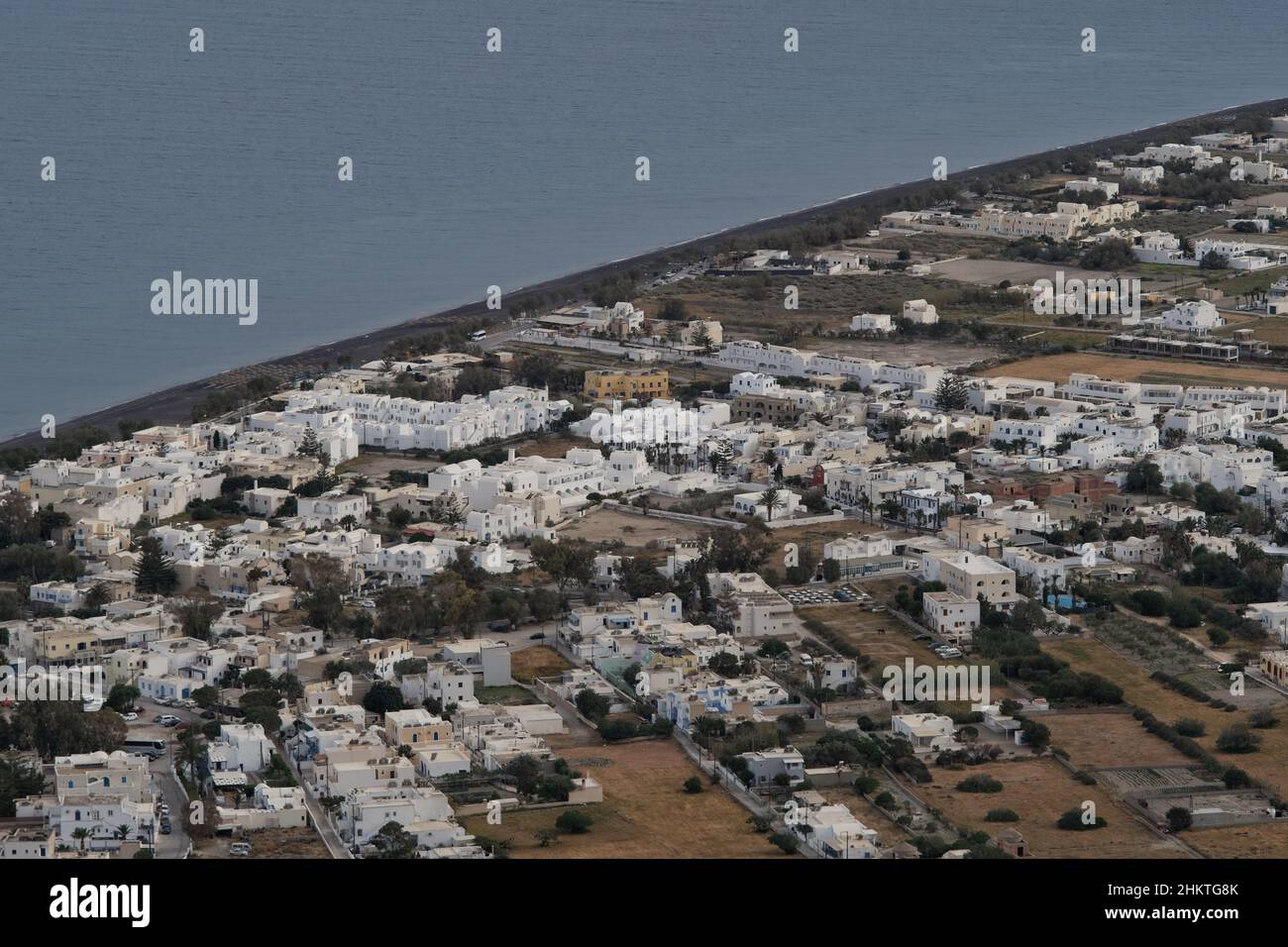 Panoramic view of the village of Perissa and the sea from a viewpoint ...