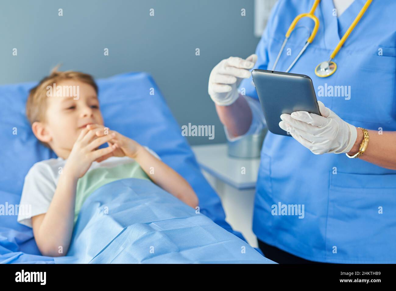 Adult woman and young patient in hospital bed Stock Photo - Alamy