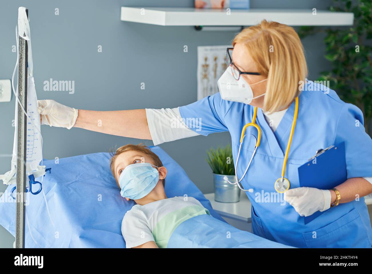 Adult woman and young patient in hospital bed Stock Photo - Alamy