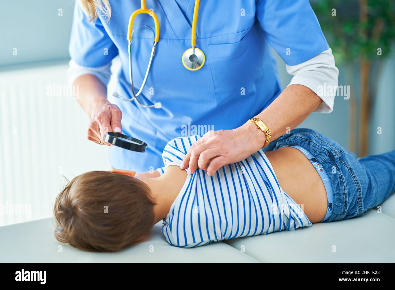 Pediatrician doctor examining little kids in clinic ears check Stock ...