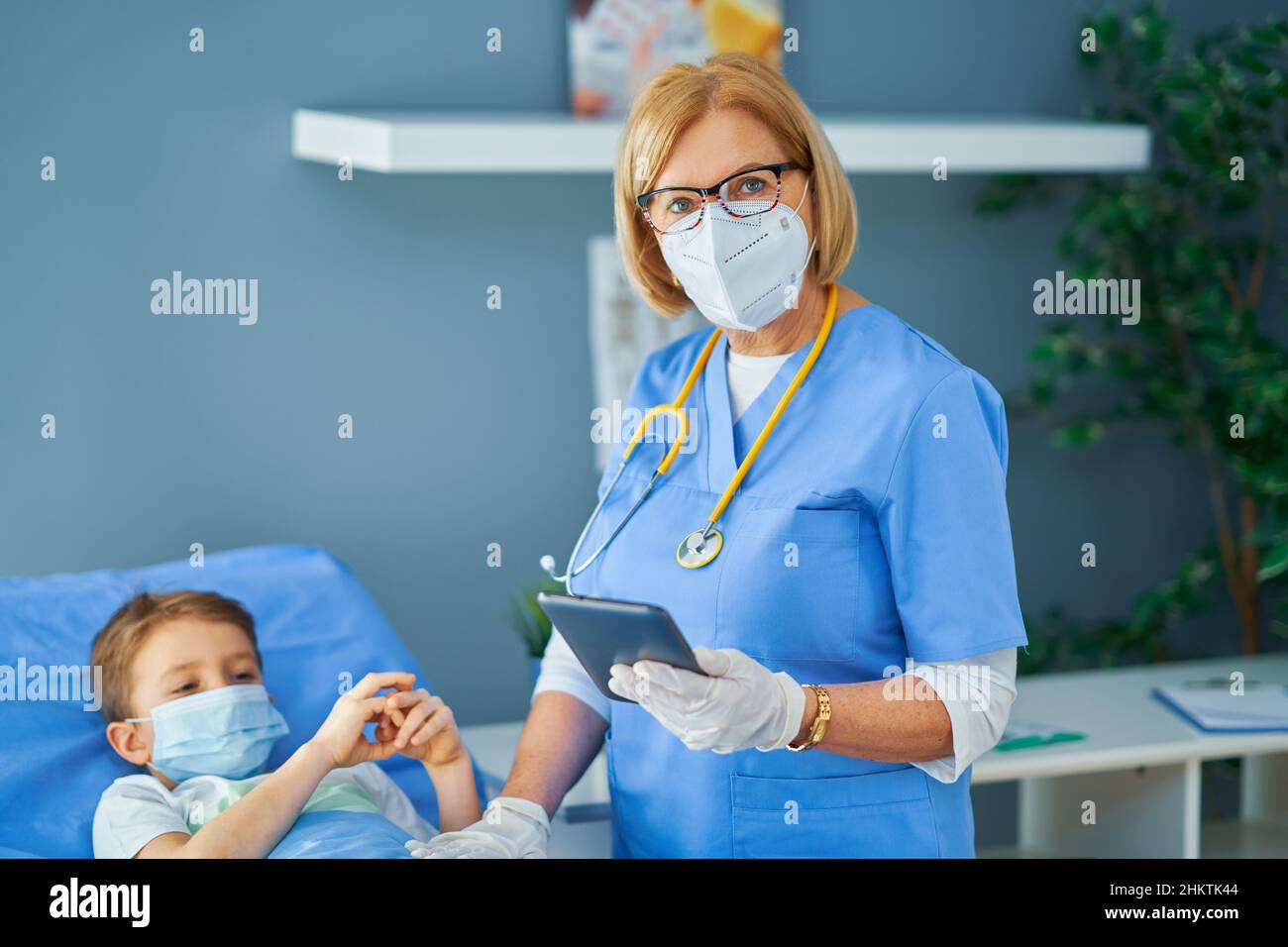 Adult woman and young patient in hospital bed Stock Photo - Alamy