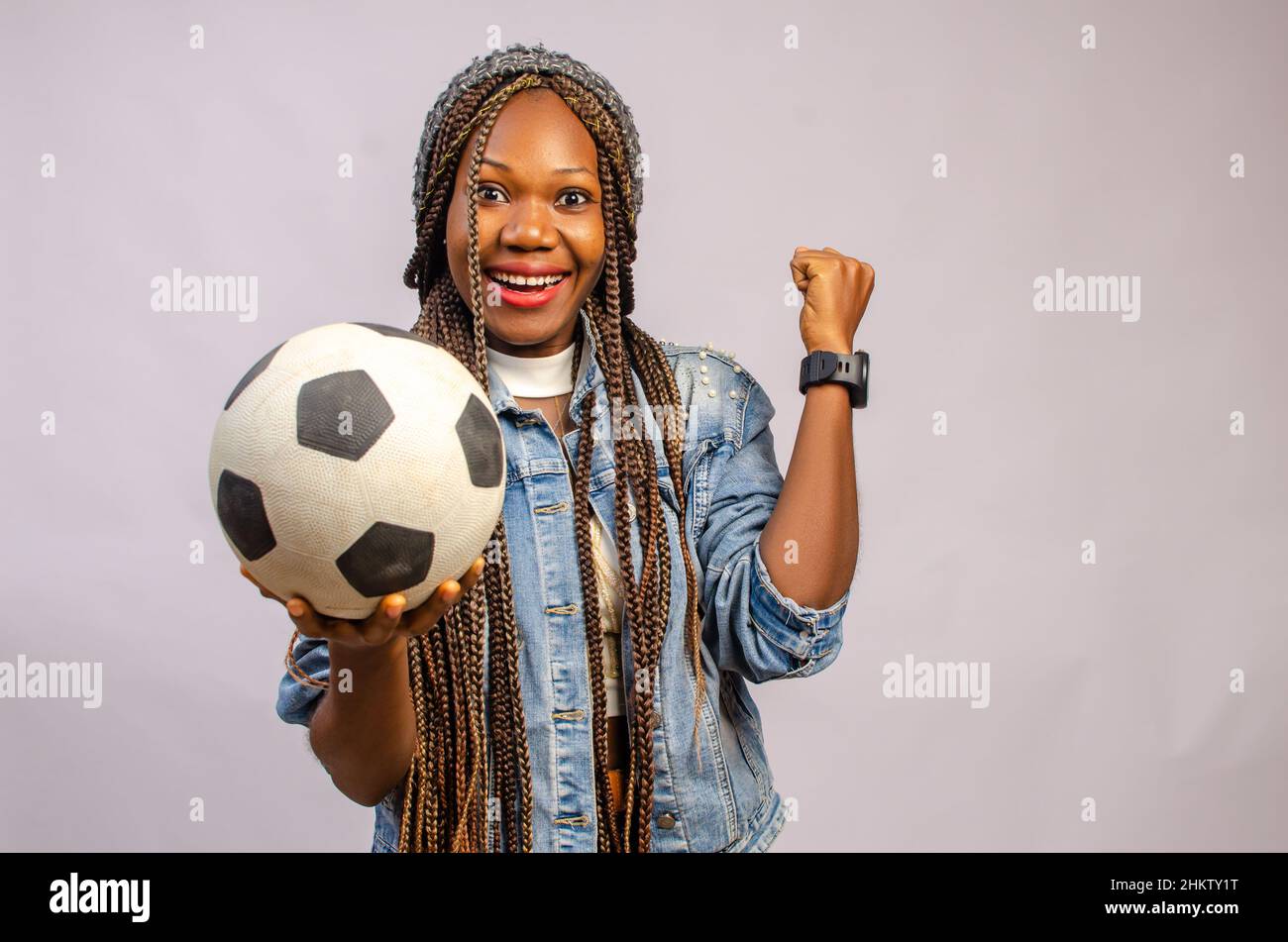 overexcited Athletic girl isolated over white background holding a ...