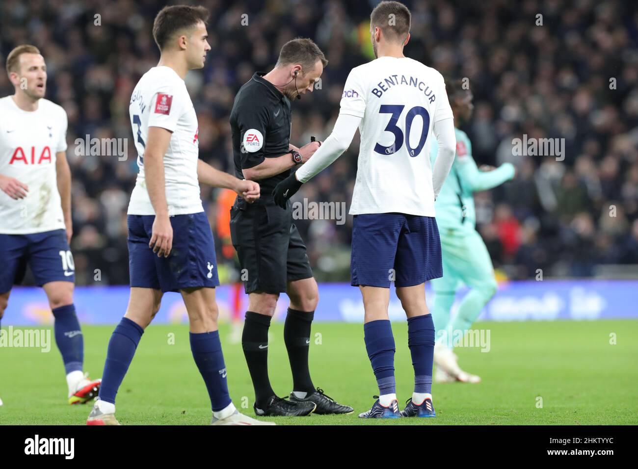 Referee stuart attwell shows a yellow card hi-res stock photography and ...
