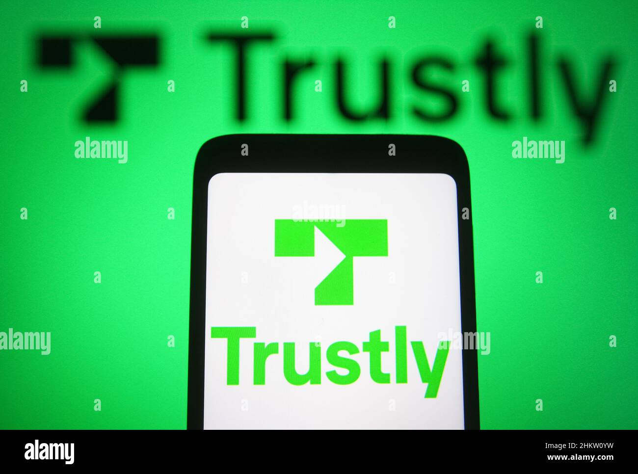 In this photo illustration, a Trustly Group logo is seen on a ...