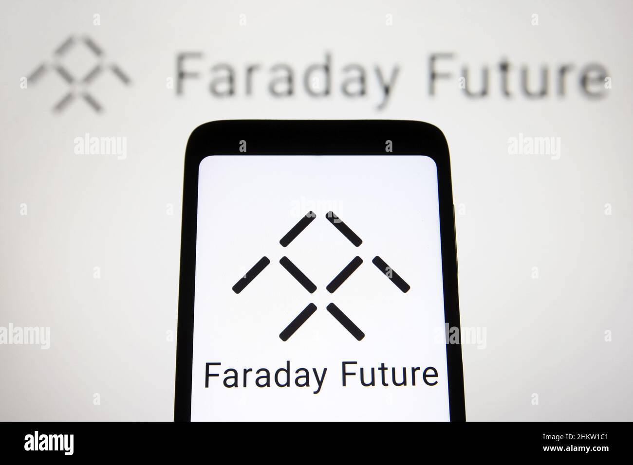 In this photo illustration, a Faraday Future Intelligent Electric Inc. logo is seen on a ...