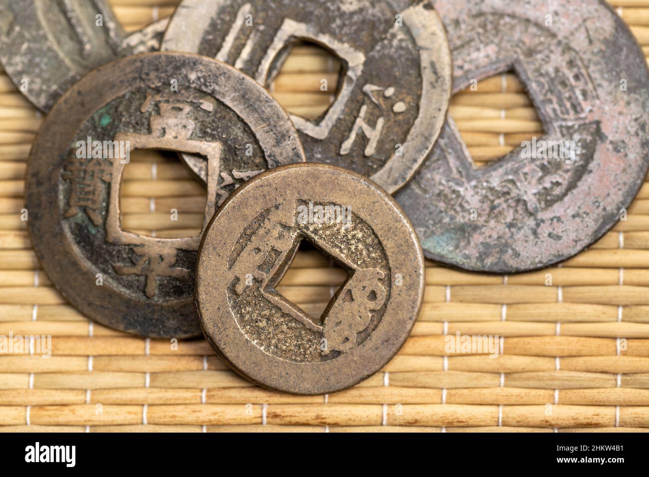 Antique Coins From Asia worn and faded some brass and silver Stock Photo - Alamy