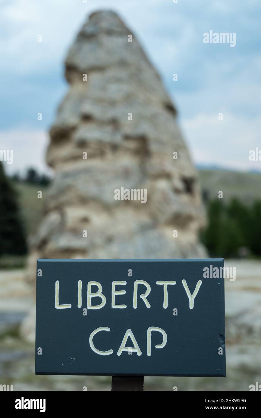 Liberty Cap Geyser and Sign in the Mammoth Hot Spring area of ...