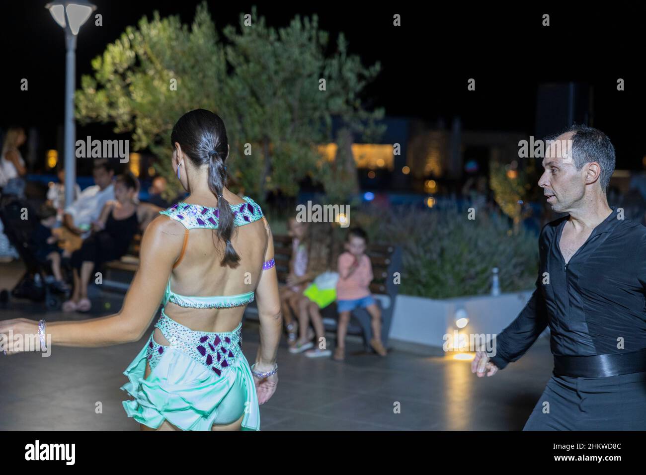 Showing beautiful dancers performing in front of tourists with ...