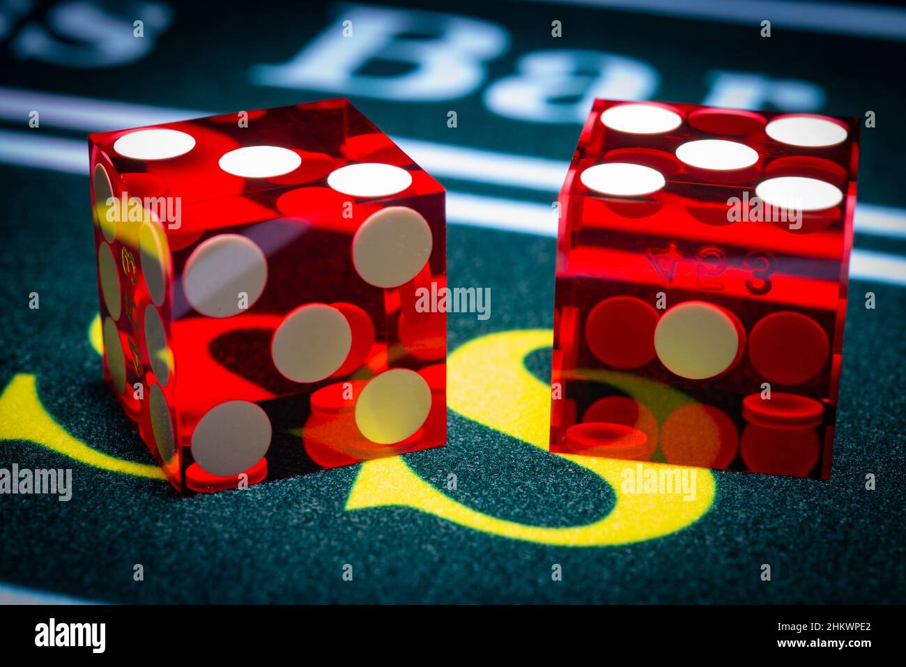 A macro photograph of professional casino-style dice sitting on the ...