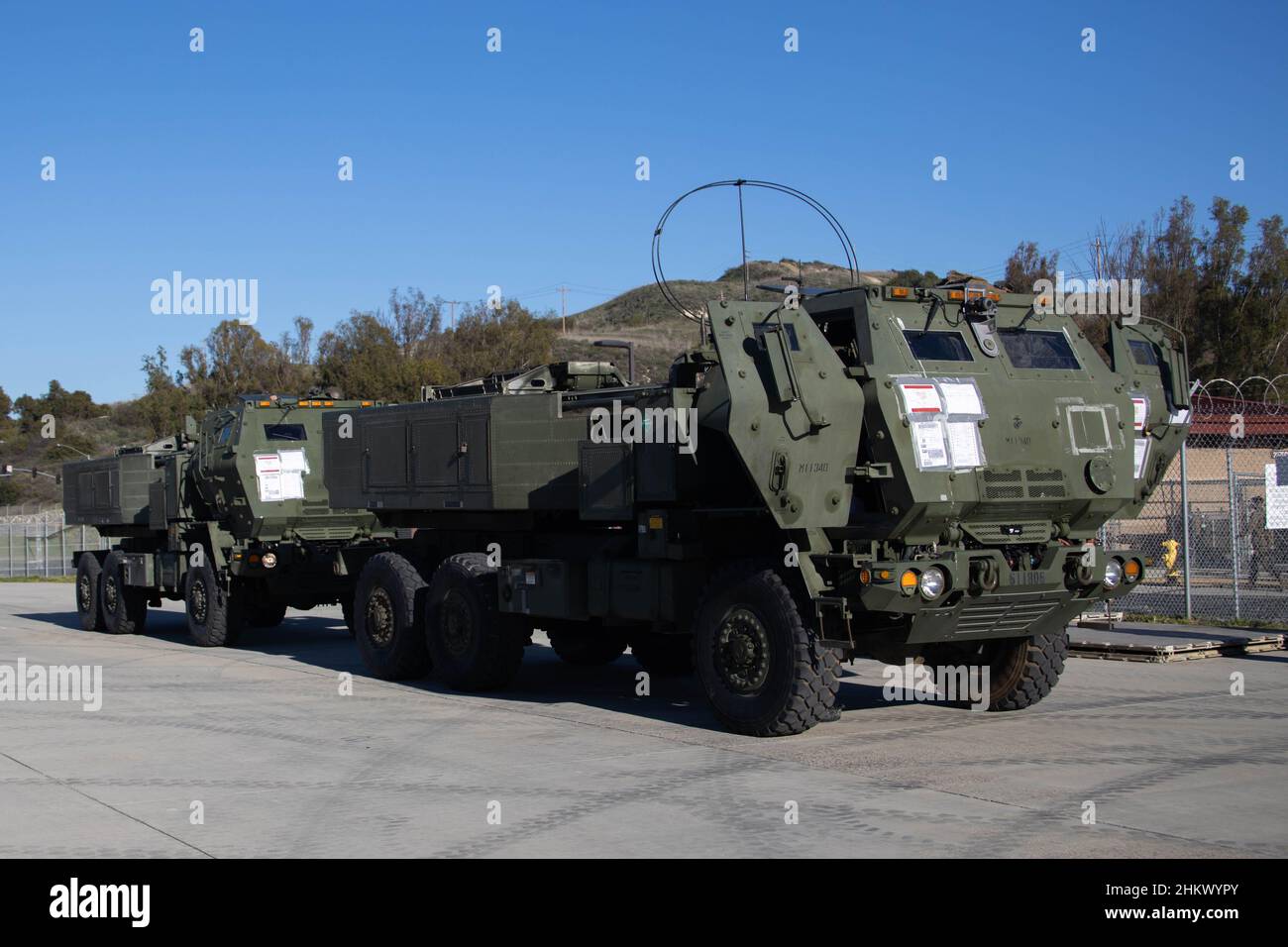 U.S. Marine Corps High Mobility Artillery Rocket Systems are staged on ...