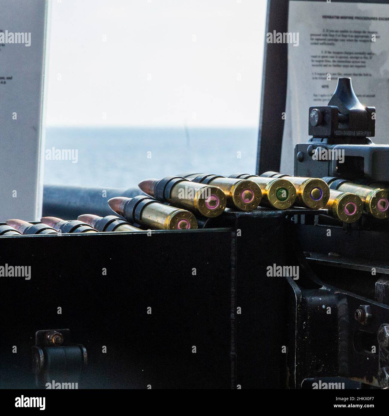 .50 caliber rounds are loaded into a .50 caliber machine gun during a ...