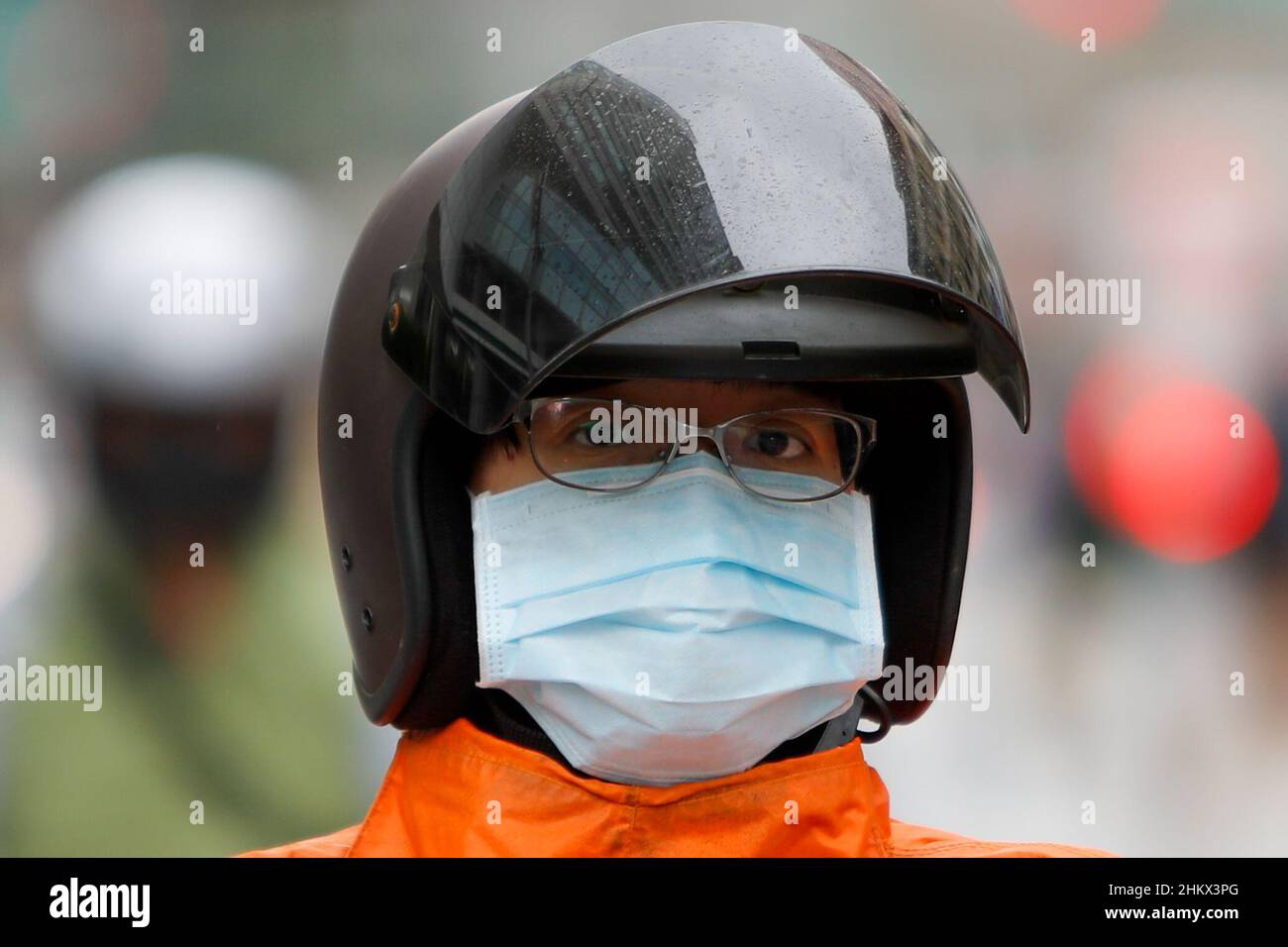 Taipei, Taipei, Taiwan. 6th Feb, 2022. A motorcyclist with a face mask ...