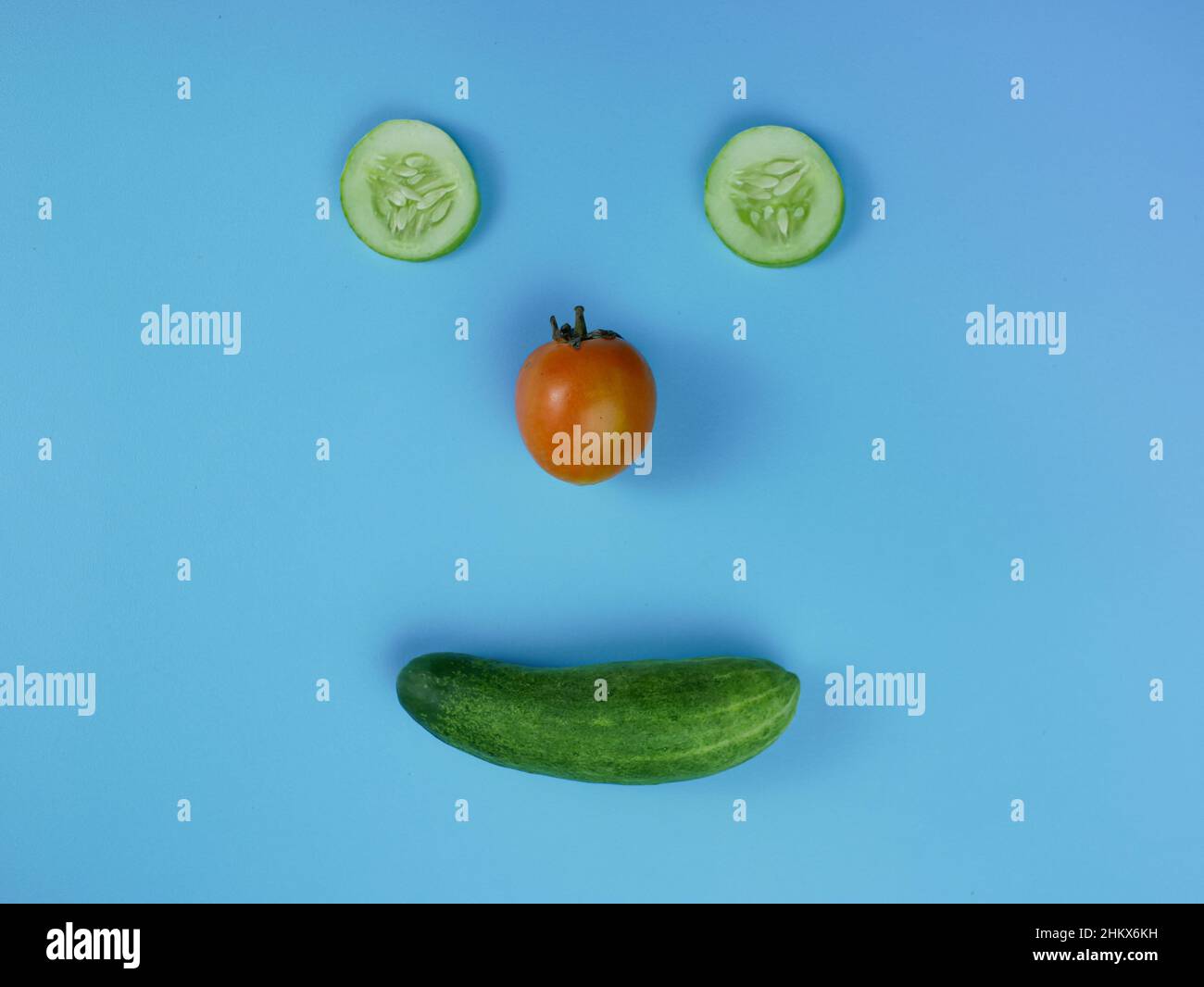 creative healthy food concept with a smiley face pattern. vegetables ...