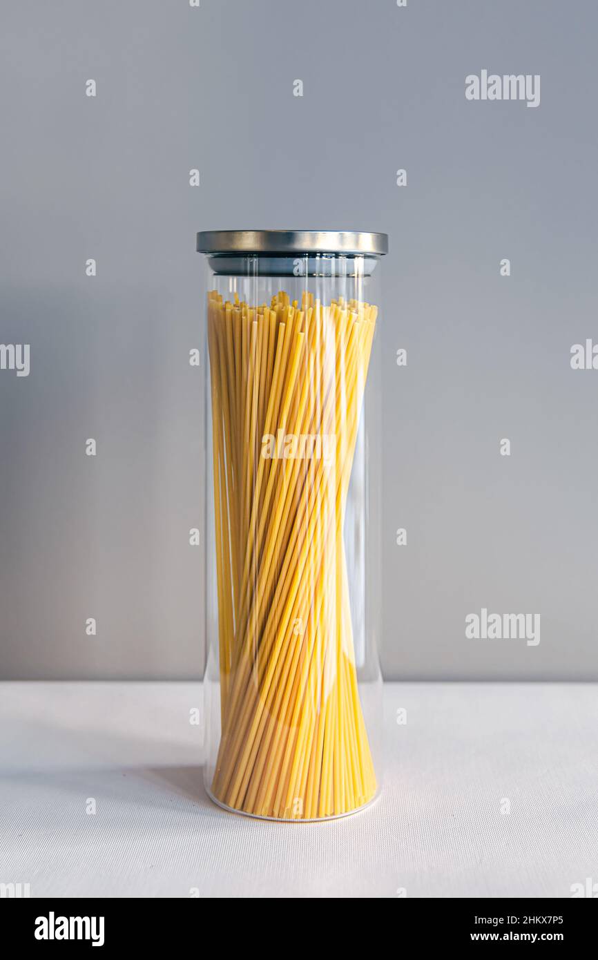 Pasta in a jar. Isolated on white background Stock Photo - Alamy