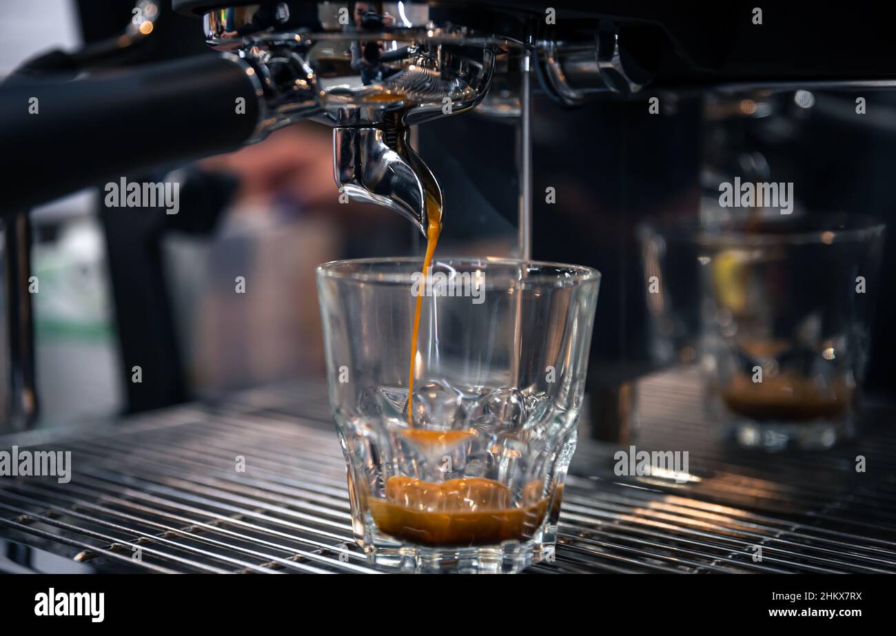 The process of preparing espresso in a professional coffee machine ...