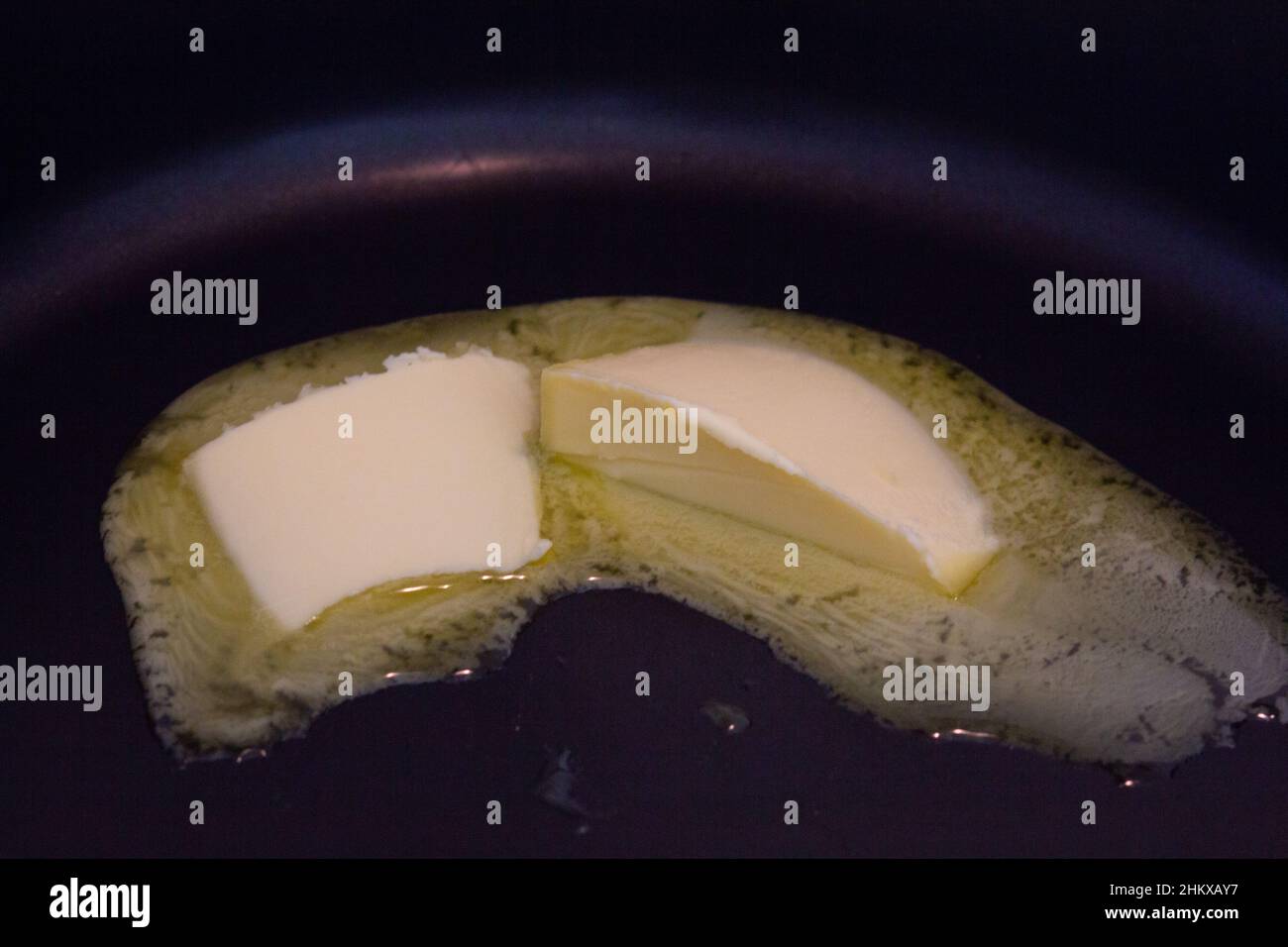 Sliced butter melting on hot pan for frying Stock Photo - Alamy