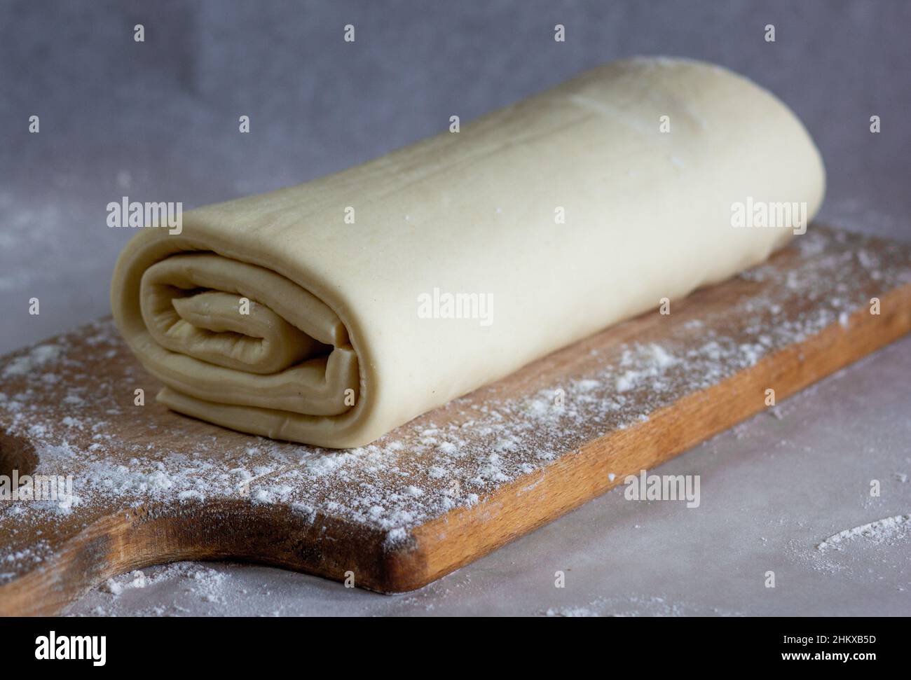 Rolled raw homemade puff pastry on the kitchen board Stock Photo - Alamy