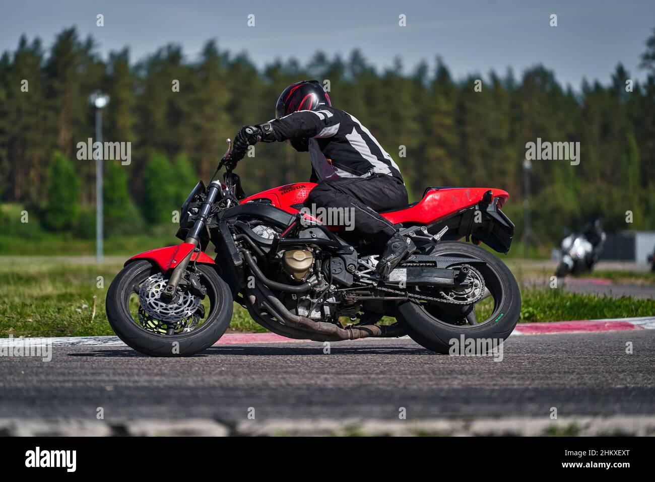 11-05-2021 Riga, Latvia Motorcyclist at sport bike rides by empty ...