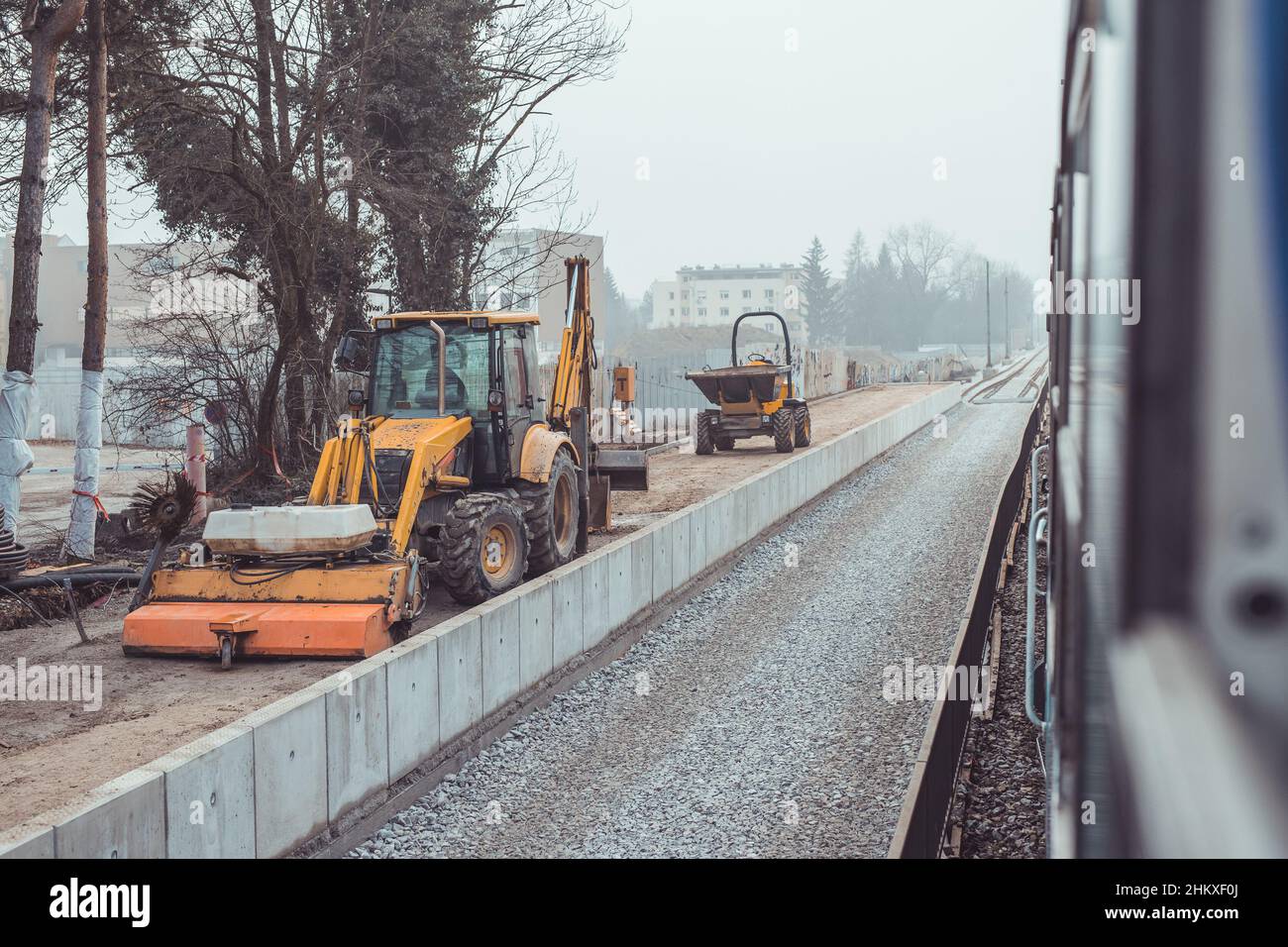Tractor with sweeper or cleaner add on with brushes, cleaning freshly ...