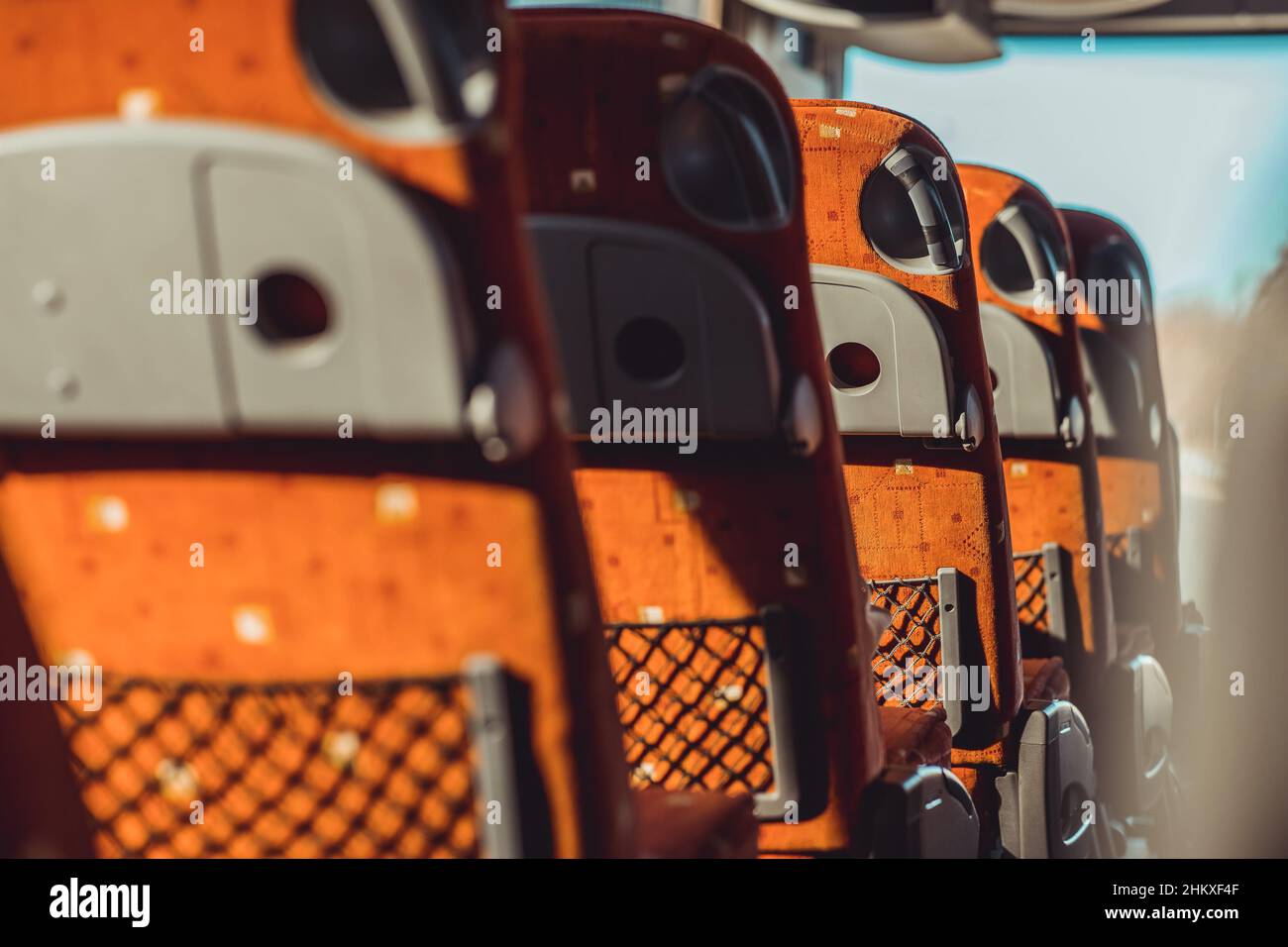 Interior of a modern passenger bus. Nets for small baggage and stowed ...