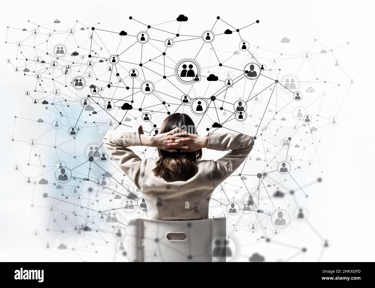 HR specialist holding hands behind head Stock Photo - Alamy