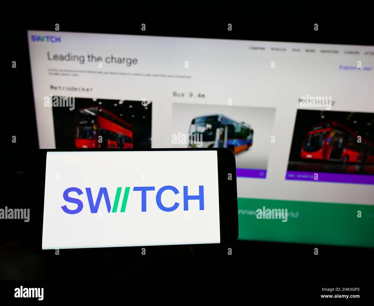 Person holding cellphone with logo of British automotive company Switch ...